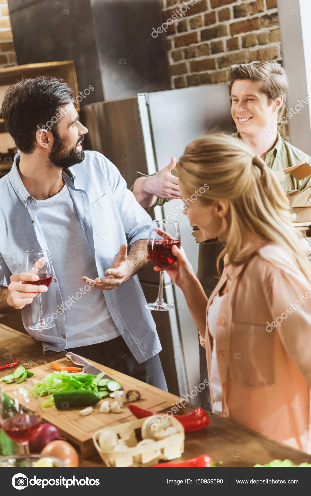 Young people partying at home Stock Photo by ©ArturVerkhovetskiy 150959590