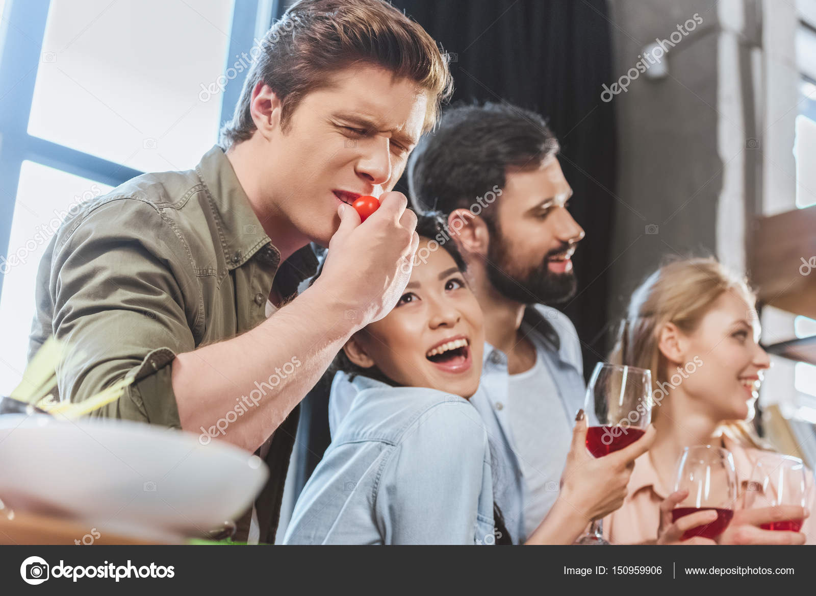 People having fun at home party — Stock Photo © ArturVerkhovetskiy ...
