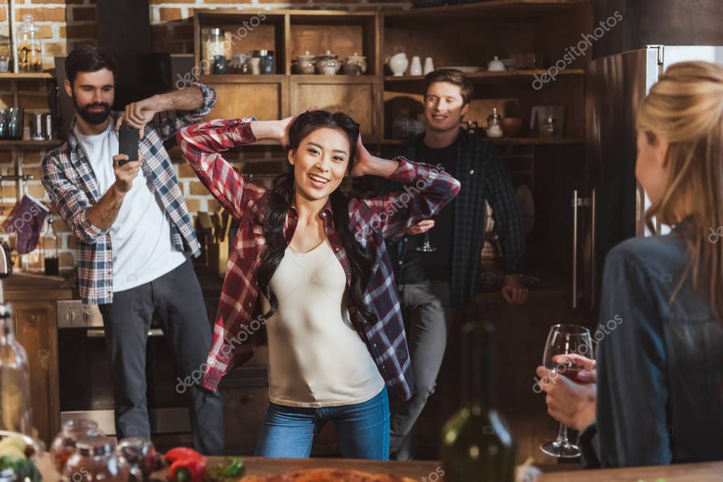 Young people partying — Stock Photo © ArturVerkhovetskiy #150956972