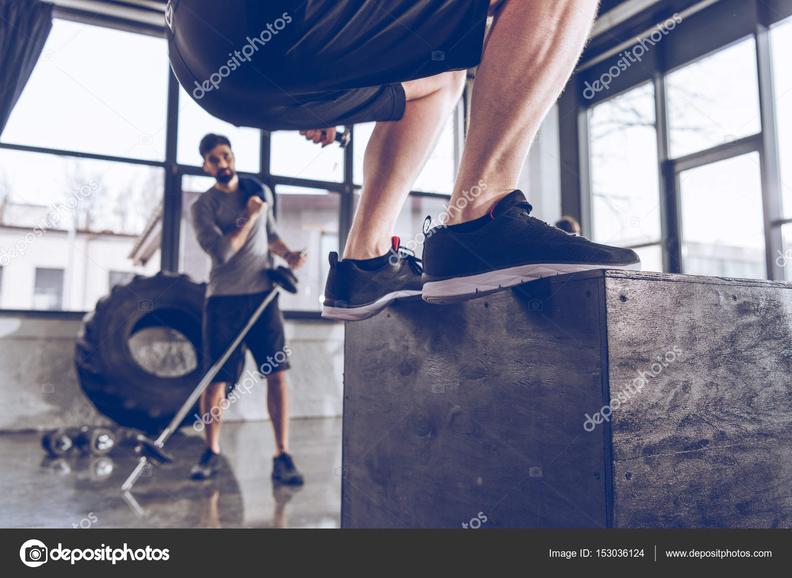 Sporty people at gym workout — Stock Photo © ArturVerkhovetskiy #153036124