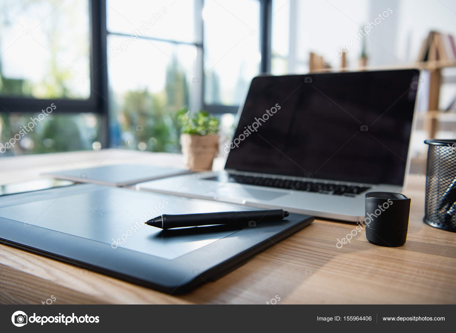 Laptop with graphics tablet on tabletop at office — Stock Photo ...