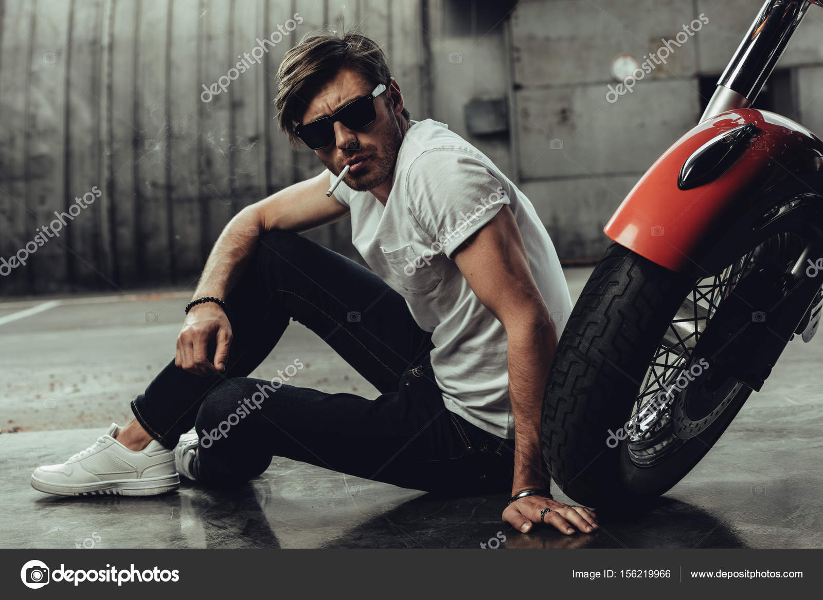 Stylish man with motorbike Stock Photo by ©ArturVerkhovetskiy 156219966