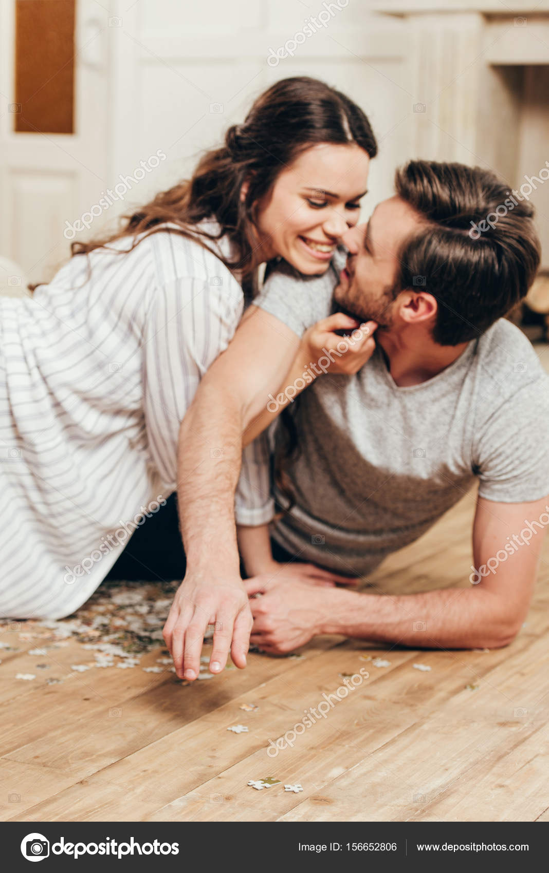 Smiling couple able to kiss at home — Stock Photo © ArturVerkhovetskiy ...