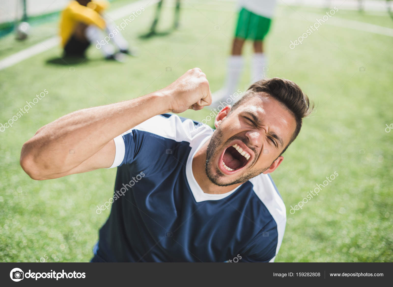 Happy soccer player — Stock Photo © ArturVerkhovetskiy #159282808