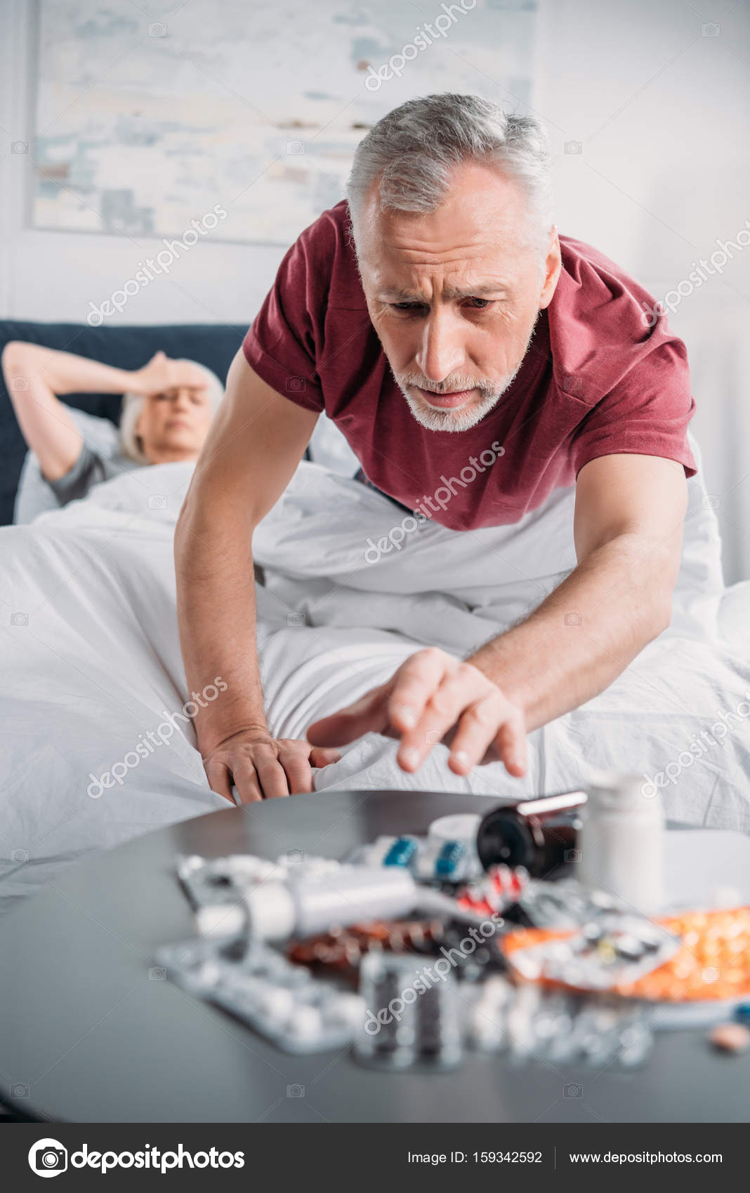 Sick couple in bed — Stock Photo © ArturVerkhovetskiy #159342592