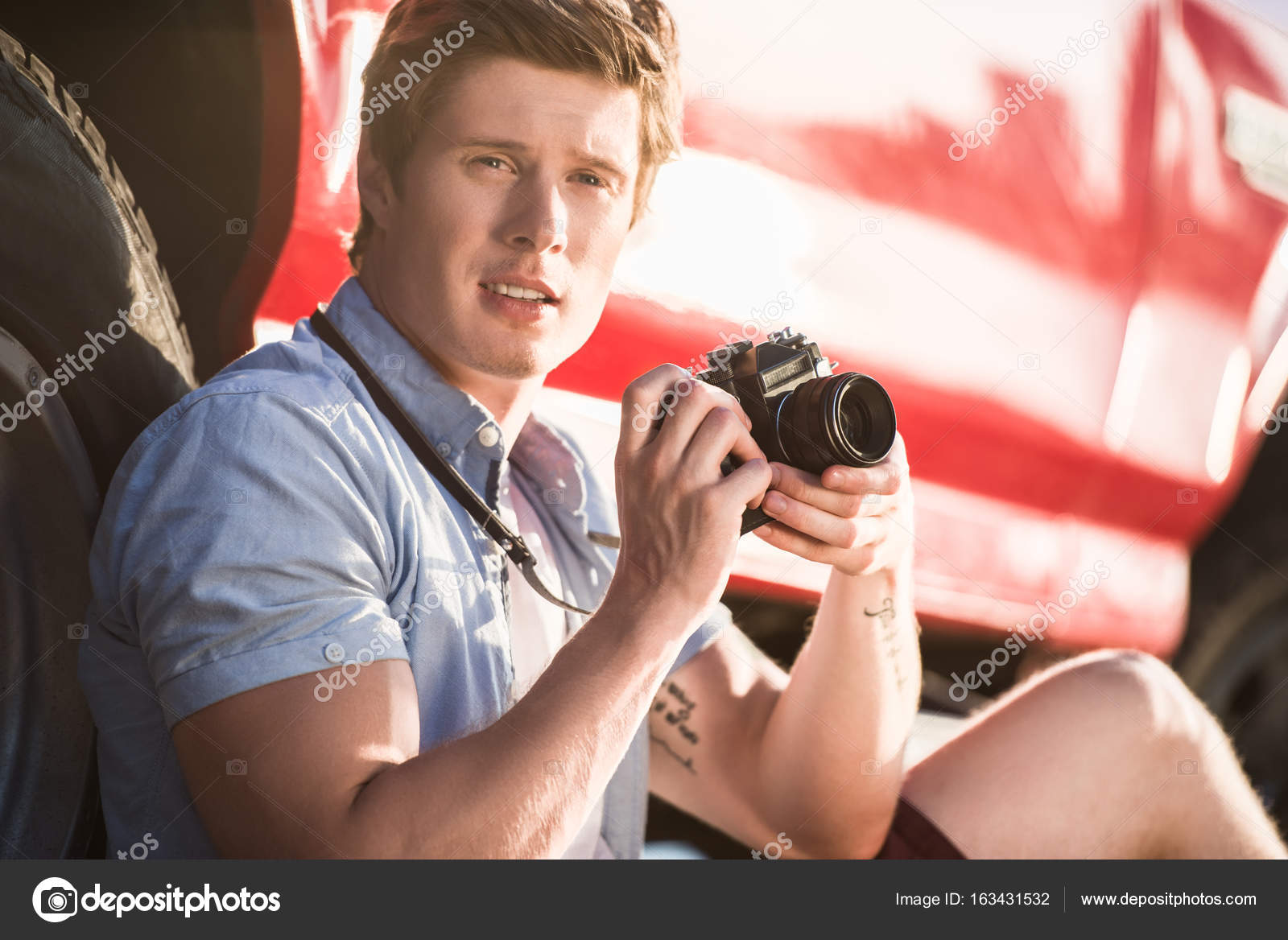 Man with vintage film camera — Stock Photo © ArturVerkhovetskiy #163431532