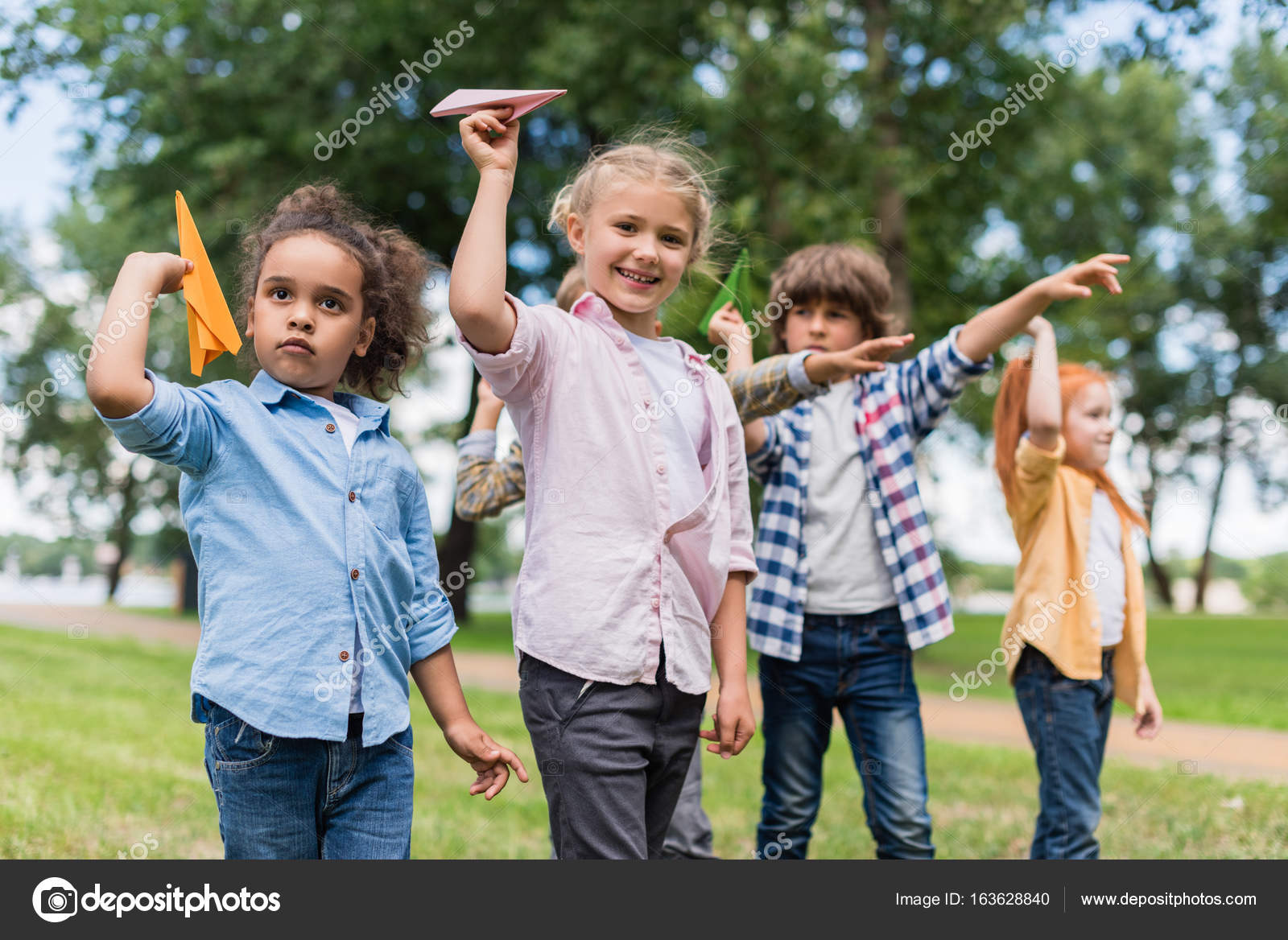Kids playing with paper planes — Stock Photo © ArturVerkhovetskiy ...