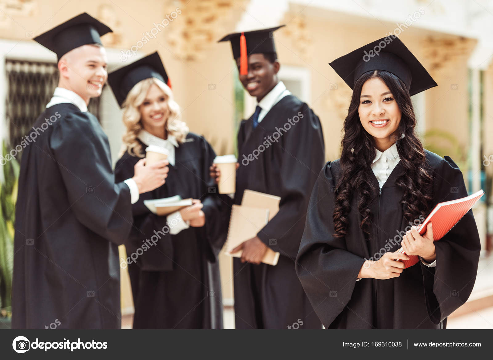 Graduated multiethnic students — Stock Photo © ArturVerkhovetskiy ...