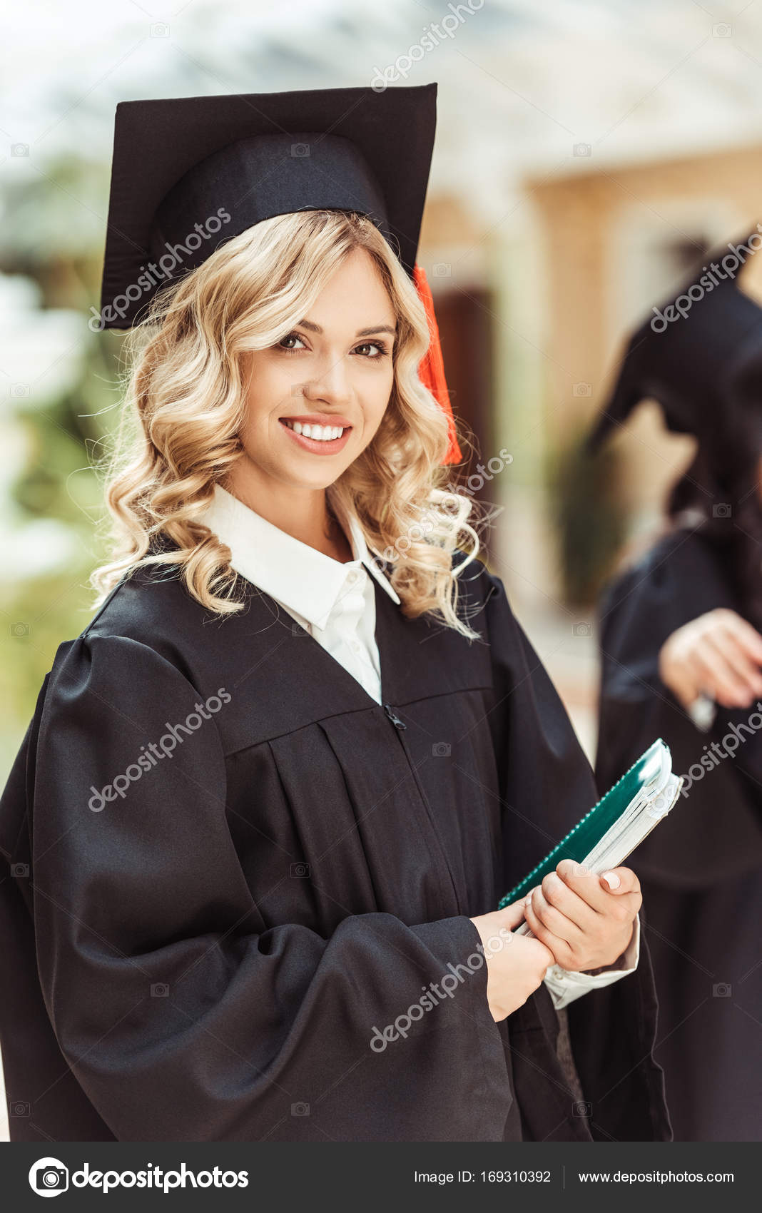 Young graduated student girl Stock Photo by ©ArturVerkhovetskiy 169310392