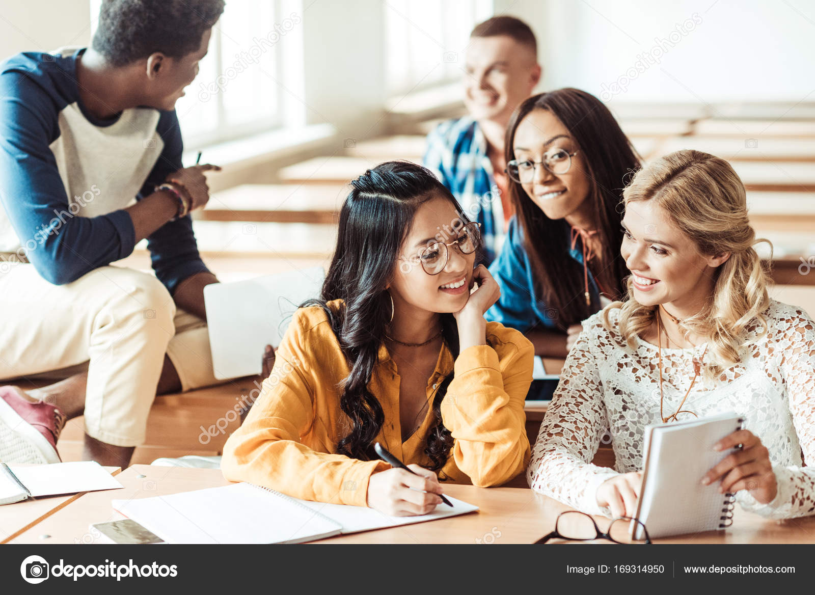 Students discussing homework — Stock Photo © ArturVerkhovetskiy #169314950