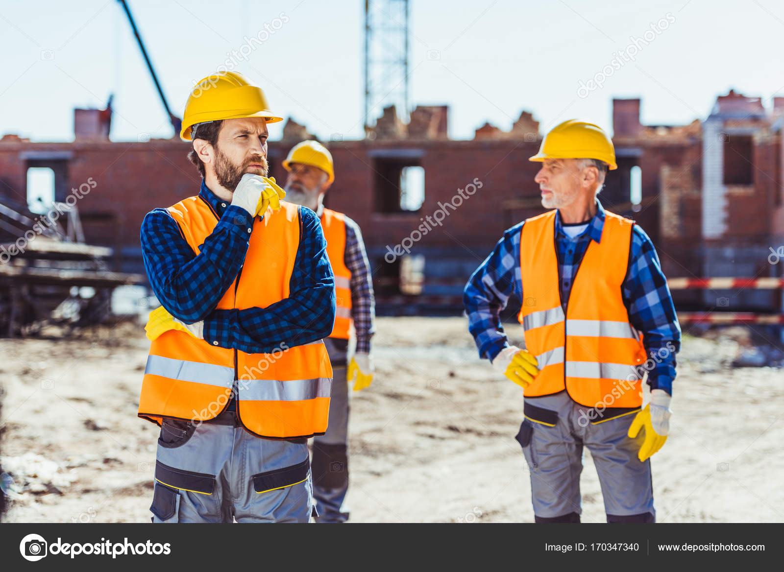 Construction workers at site — Stock Photo © ArturVerkhovetskiy #170347340