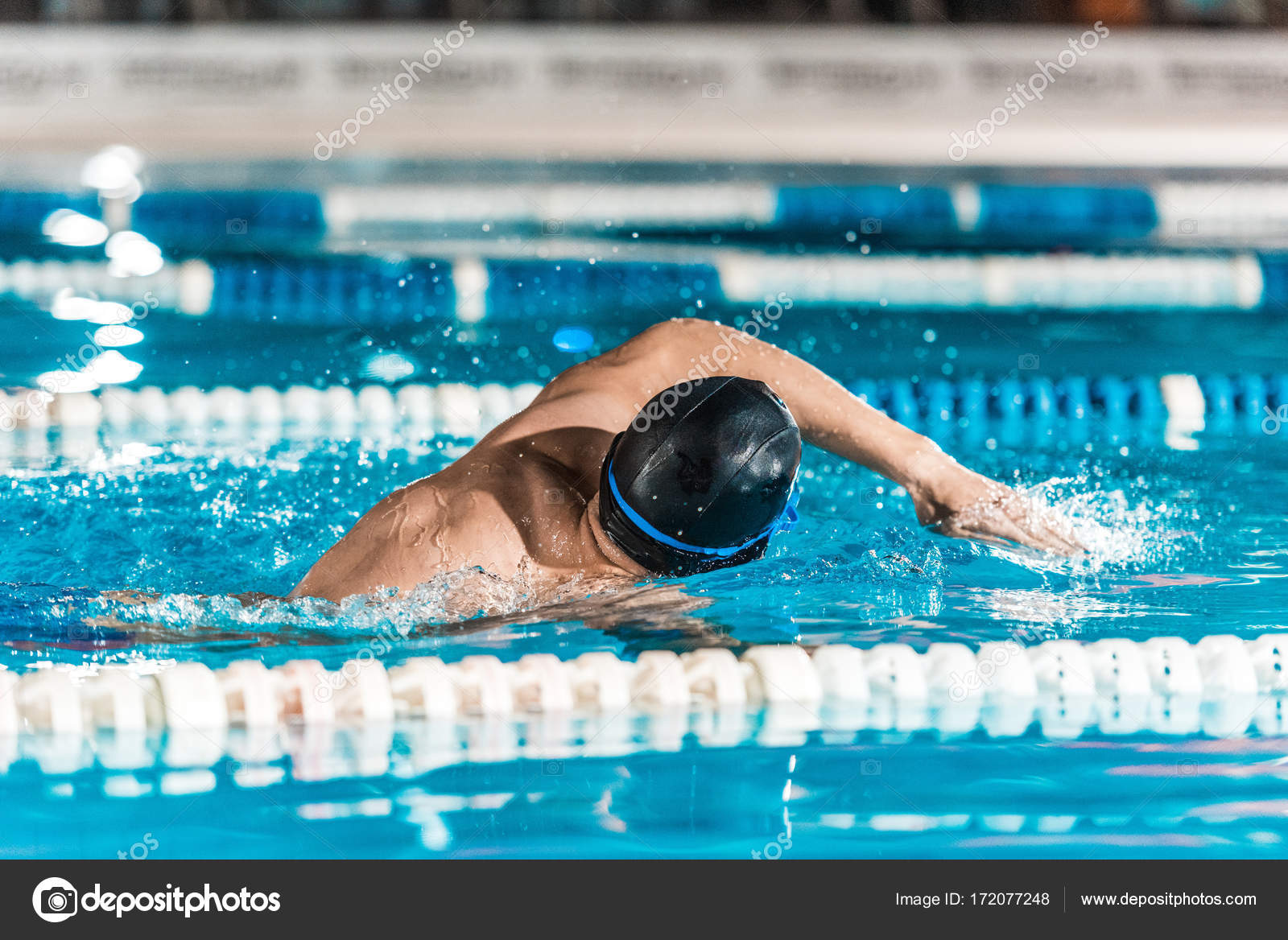 Young professional swimmer — Stock Photo © ArturVerkhovetskiy #172077248