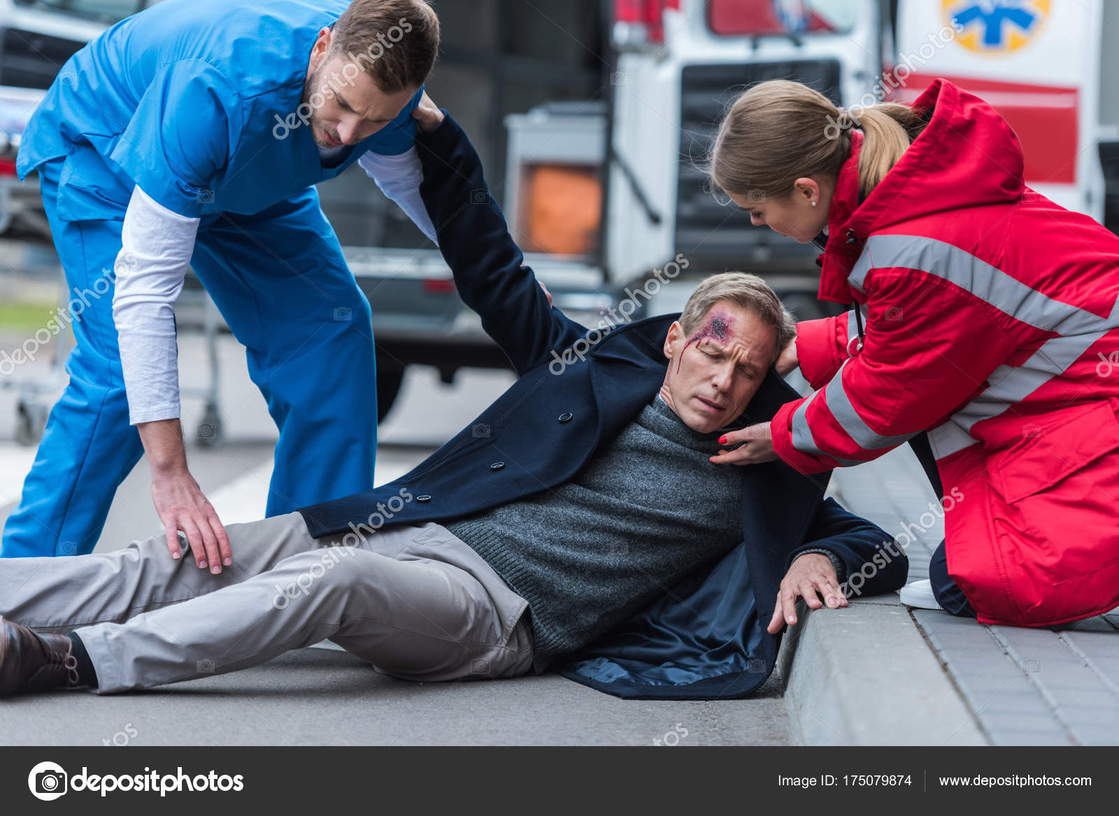 Young Male Female Paramedics Helping Injured Man Street — Stock Photo ...