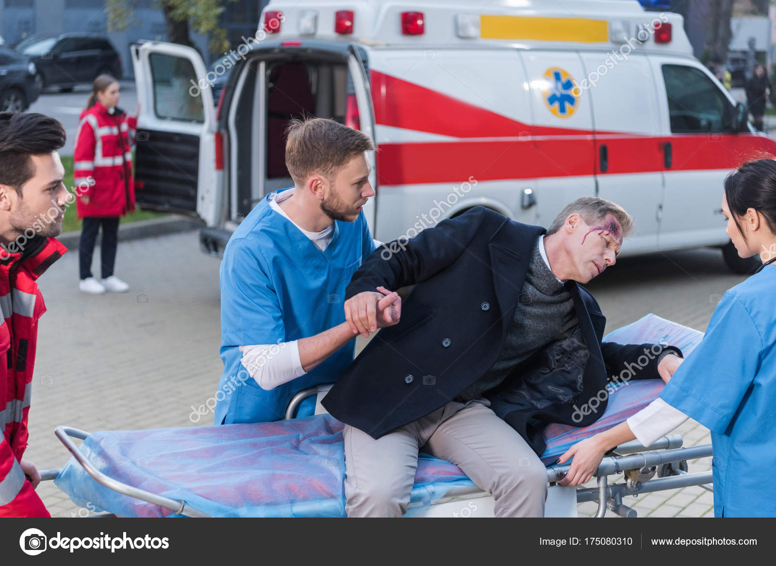 Young Paramedics Helping Injured Man Lie Ambulance Stretcher Stock ...