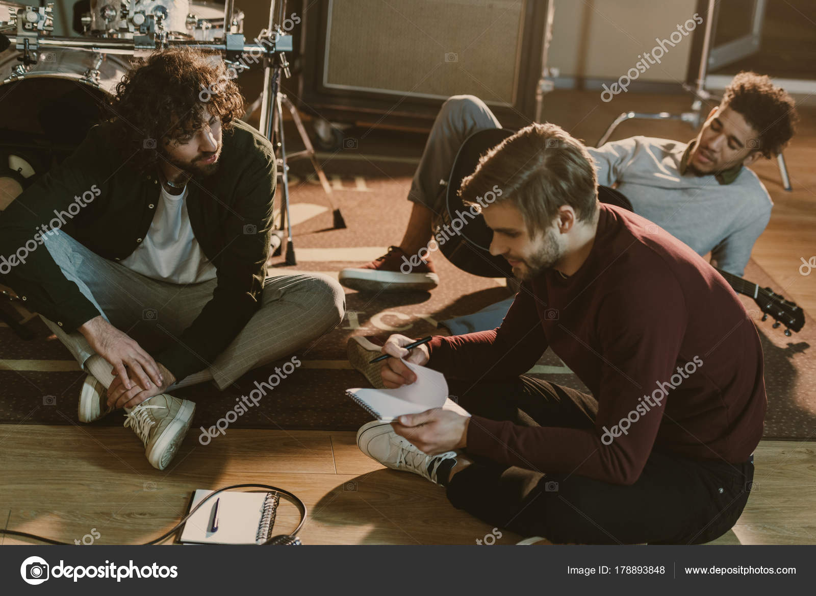 Young Music Band Writing Lyrics Together While Sitting Floor — Stock ...