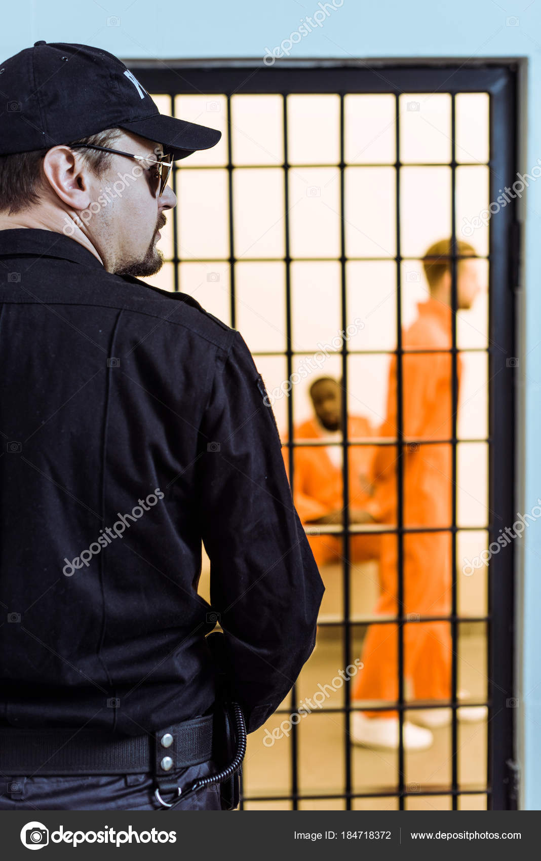 Rear View Prison Officer Standing Prison Cell Multicultural Inmates ...