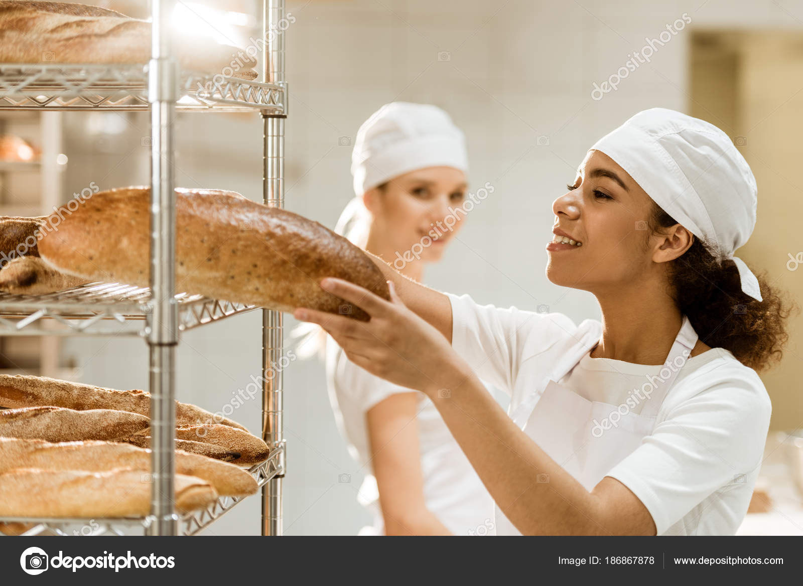Female Baker Putting Fresh Bread Loaves Shelves Baking Manufacture ...