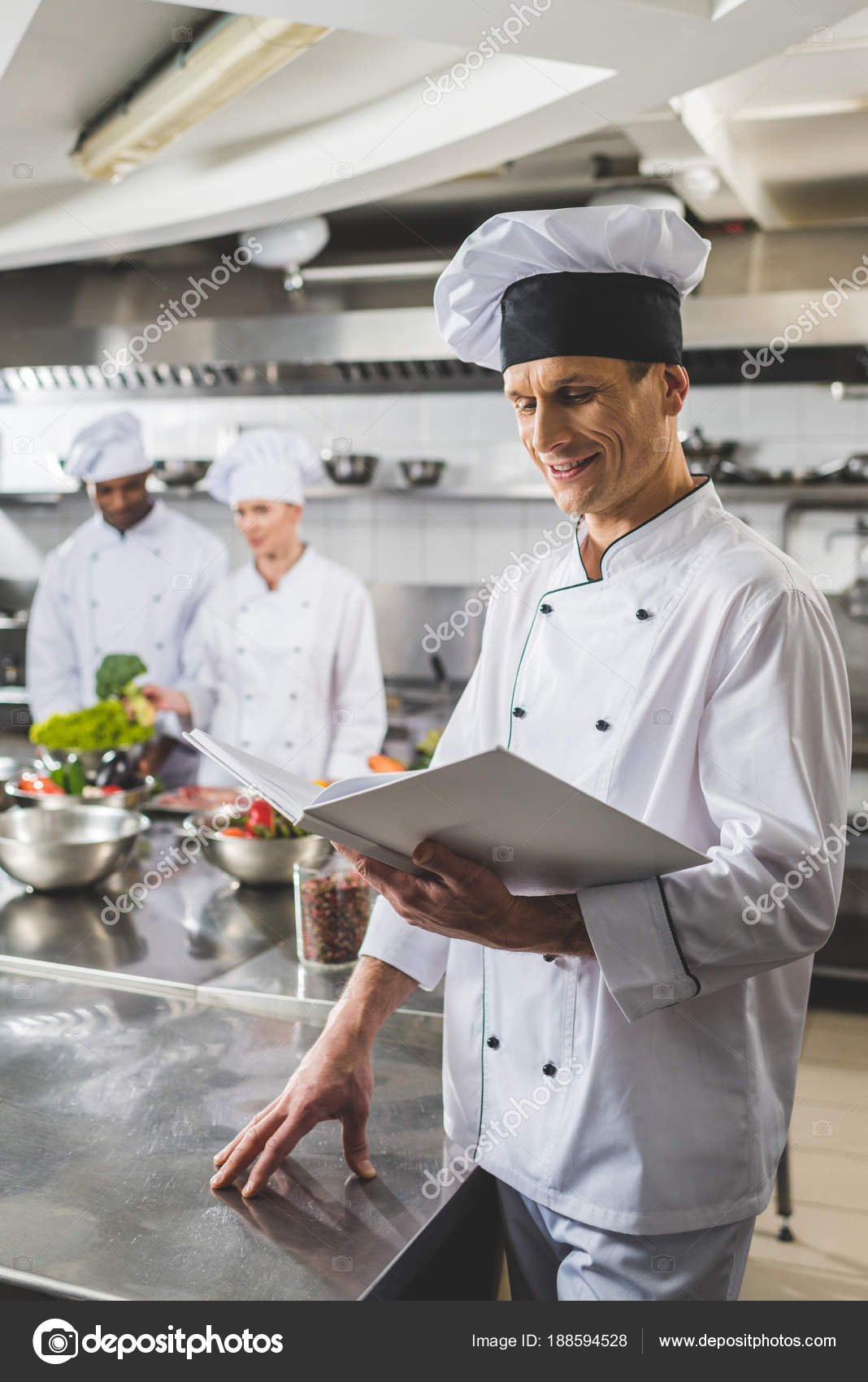 Smiling Chef Reading Recipe Restaurant Kitchen — Free Stock Photo ...