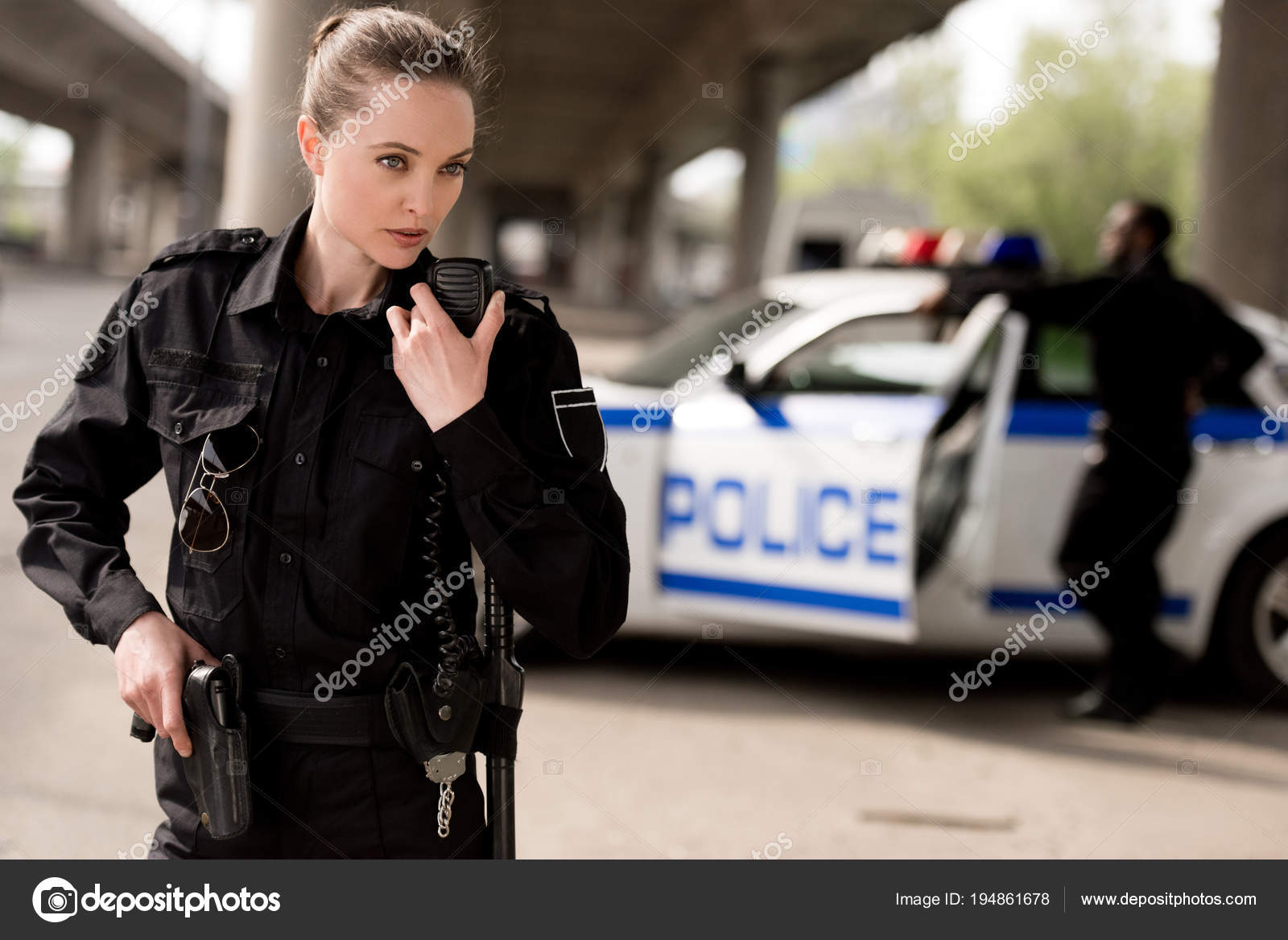Young Attractive Policewoman Using Walkie Talkie Blurred Partner Car ...