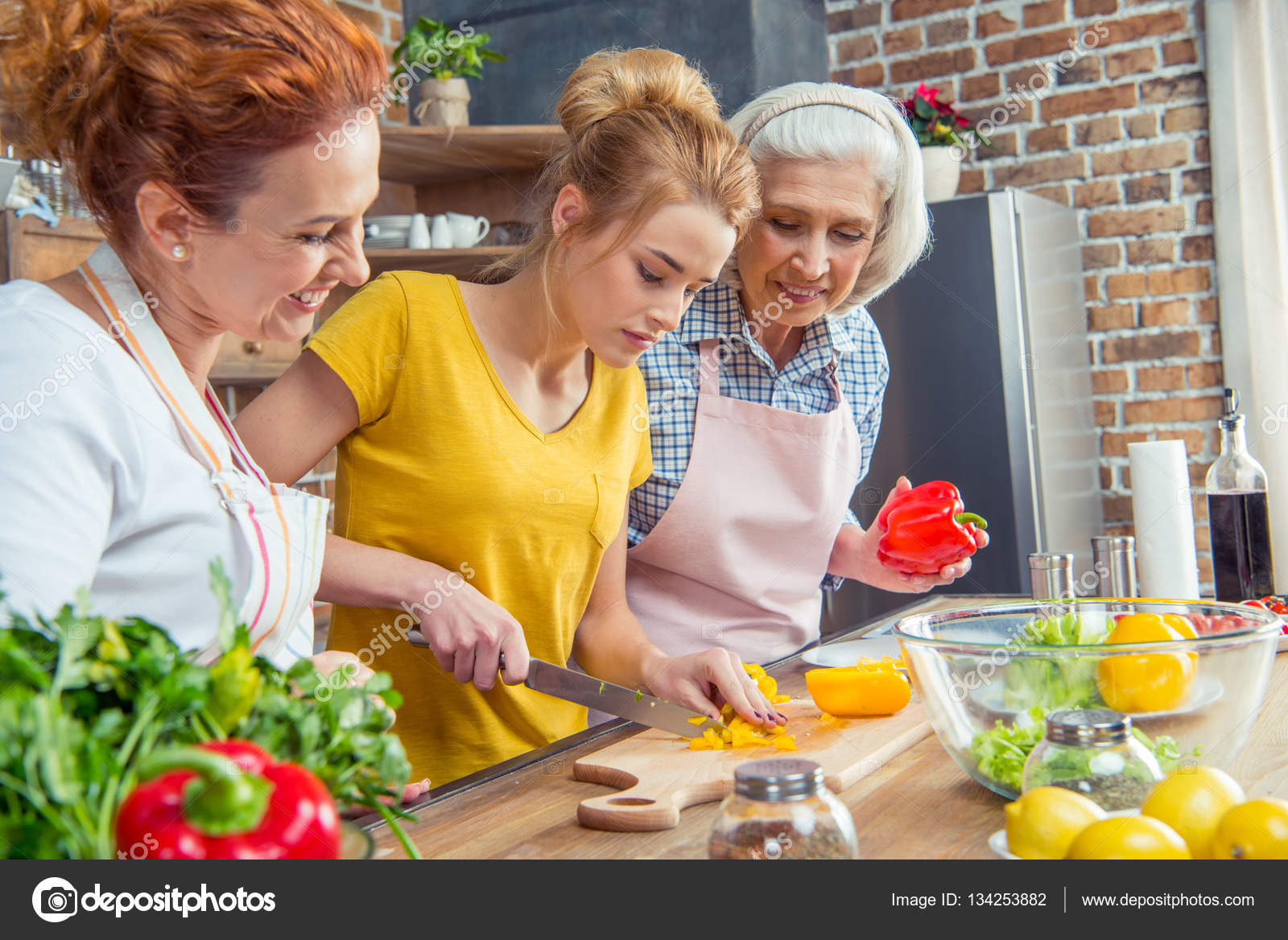 Family cooking together in kitchen Stock Photo by ©DmitryPoch 134253882