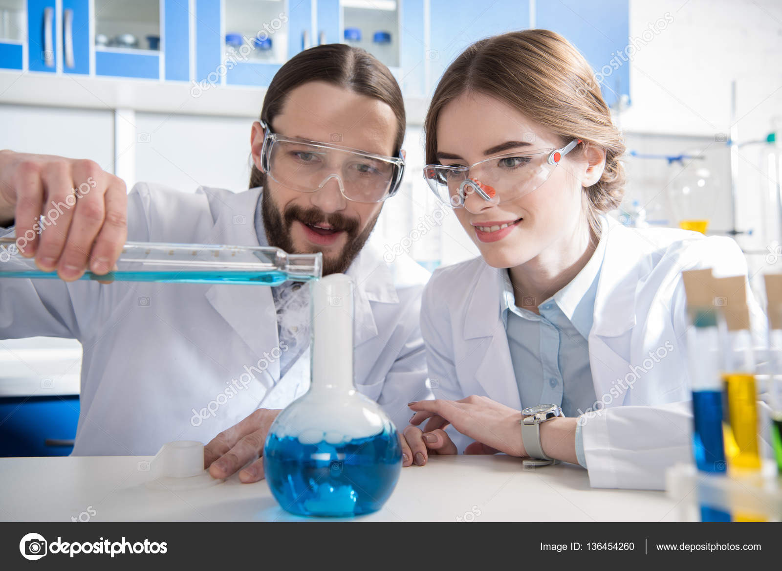 Scientists making experiment Stock Photo by ©DmitryPoch 136454260