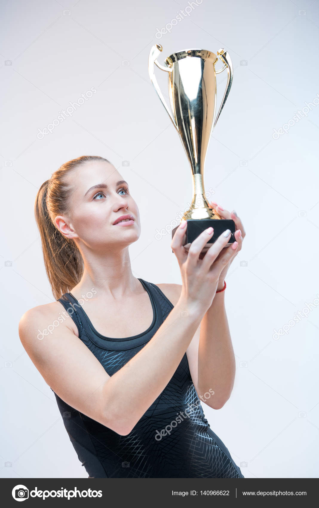 Woman holding trophy — Stock Photo © DmitryPoch #140966622 Woman holding trophy — Stock Photo © DmitryPoch #140966622