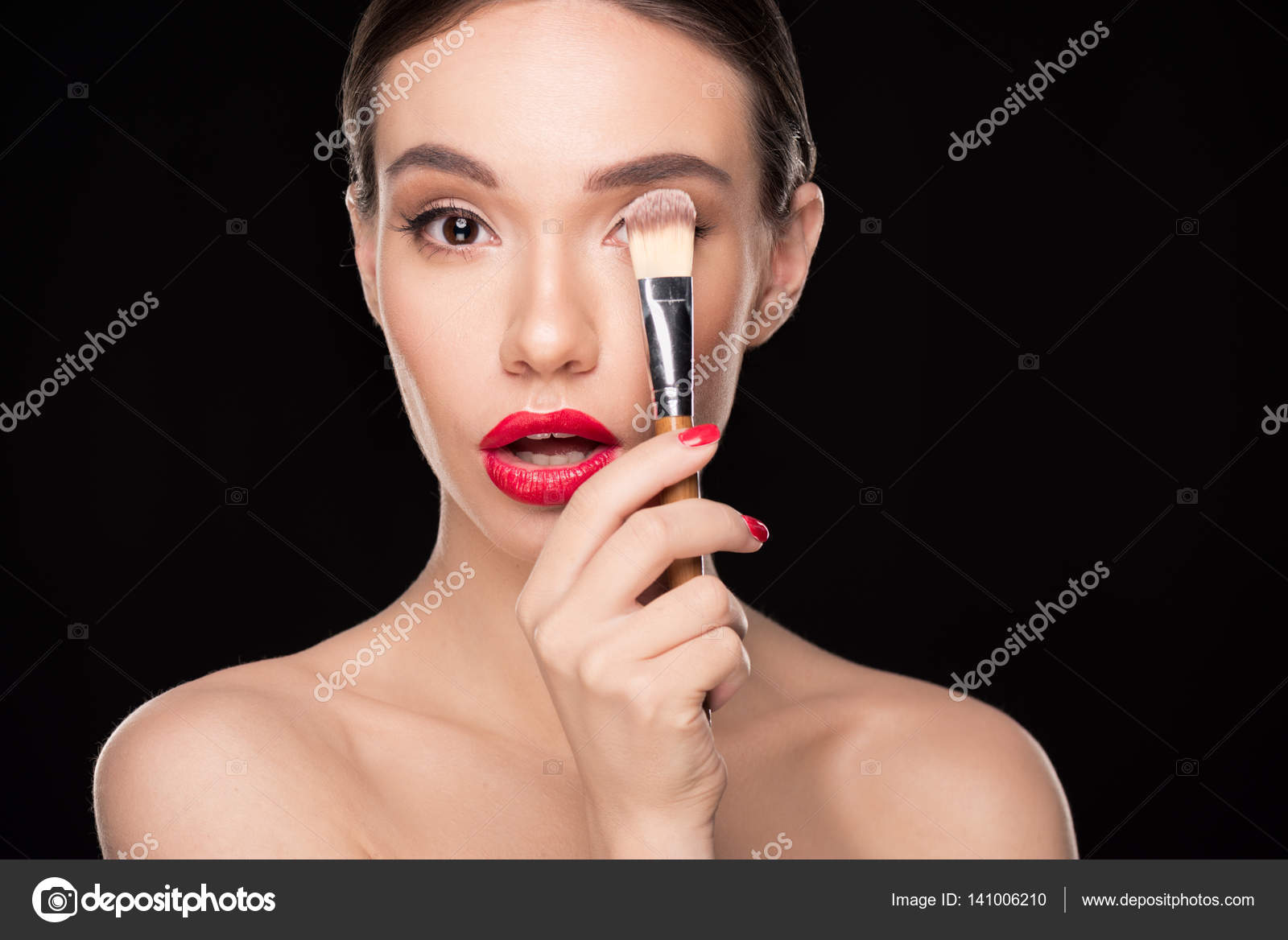 Woman applying makeup ⬇ Stock Photo, Image by © DmitryPoch #141006210