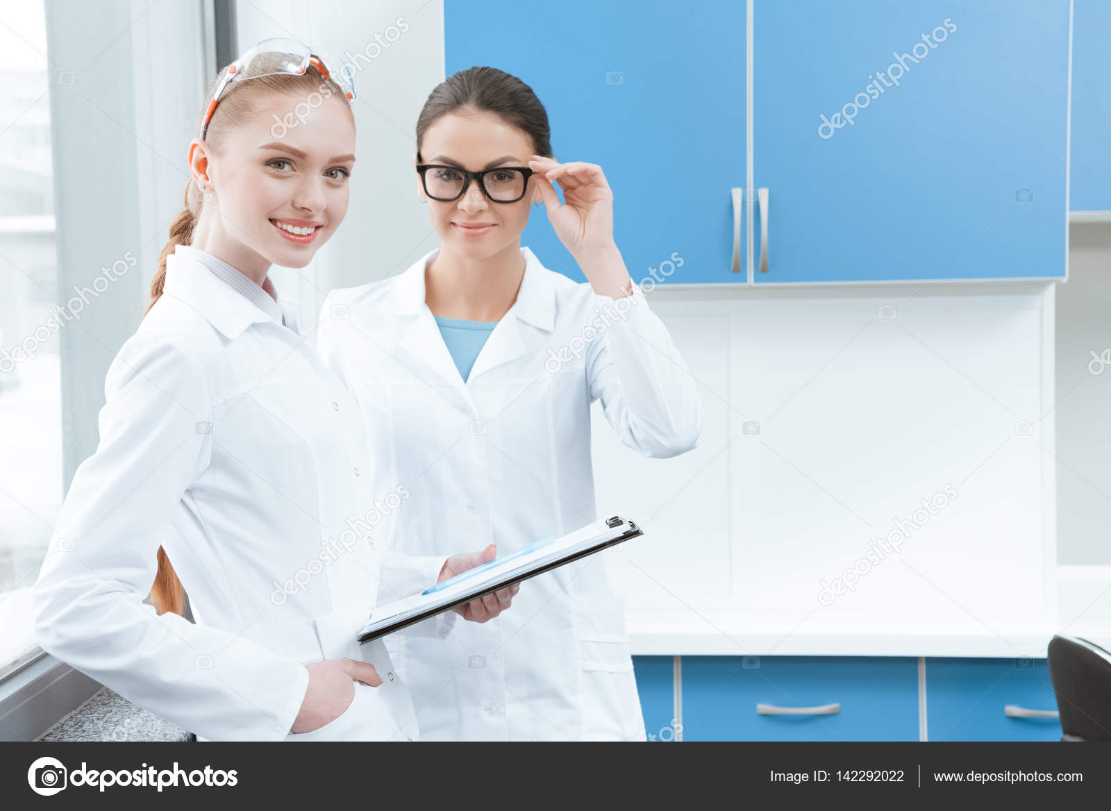 Young women scientists — Stock Photo © DmitryPoch #142292022 Young women scientists — Stock Photo © DmitryPoch #142292022