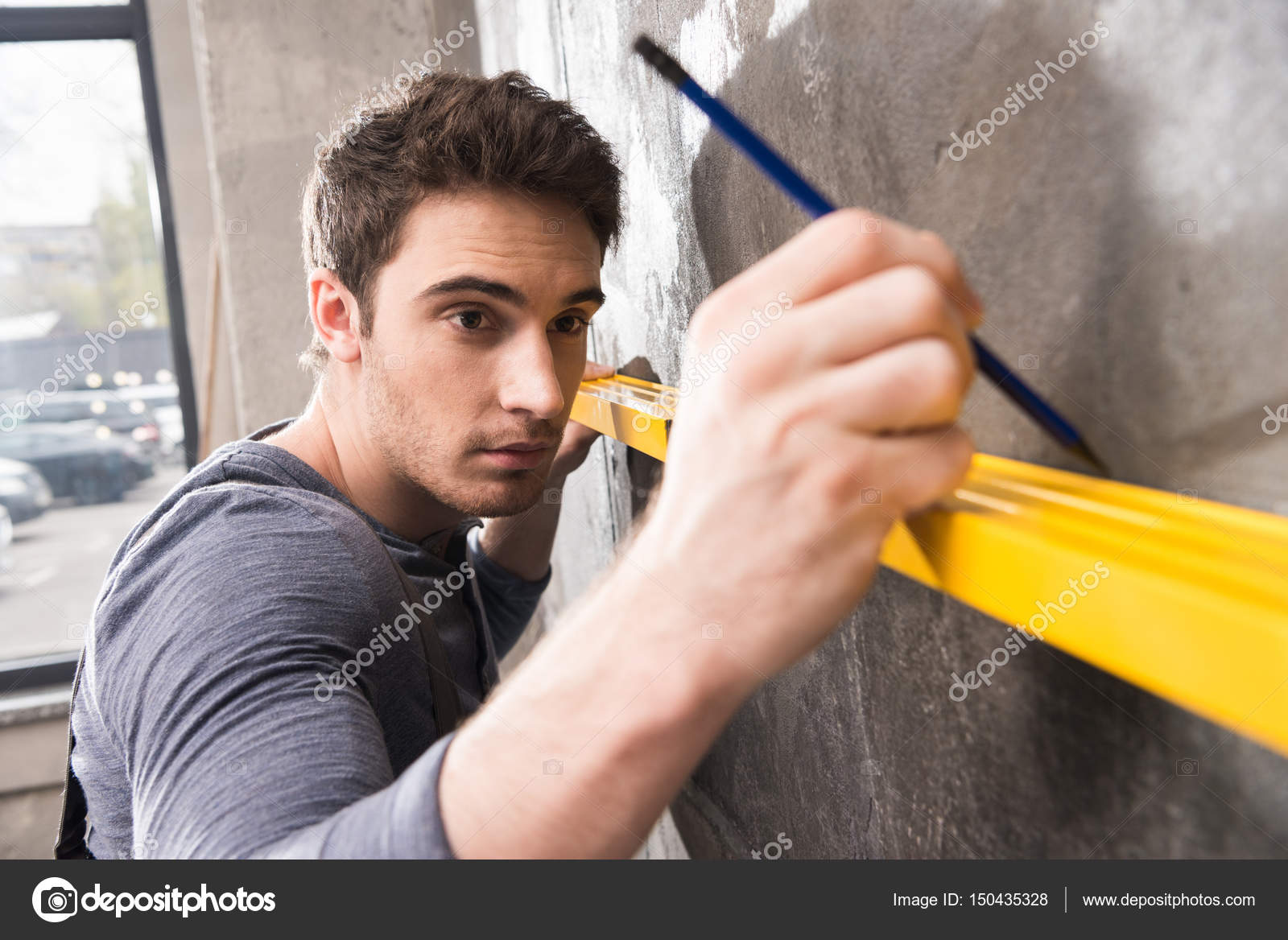 Young laborer with level tool — Stock Photo © DmitryPoch #150435328