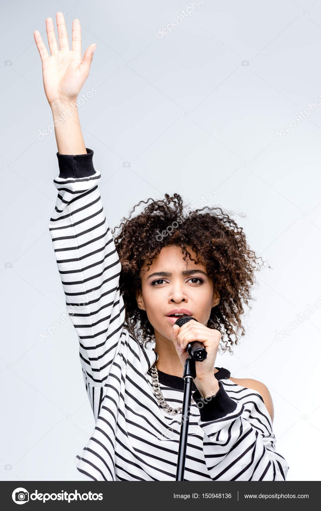 Young singer with microphone — Stock Photo © DmitryPoch #150948136