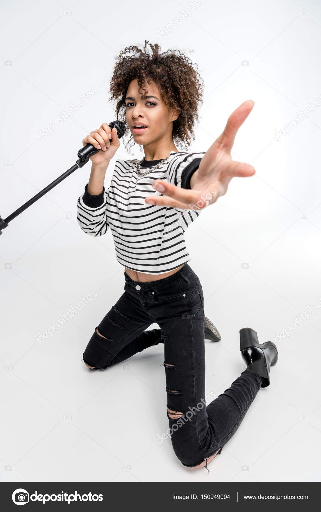 Young singer with microphone — Stock Photo © DmitryPoch #150949004