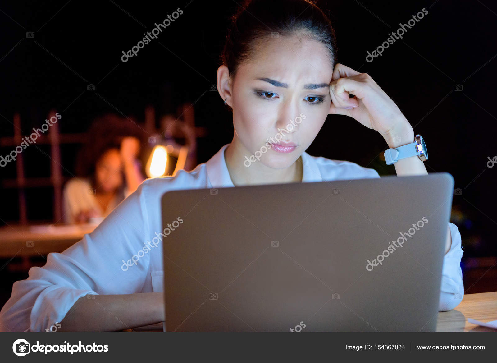 Pensive asian businesswoman working on laptop Stock Photo by ... Pensive asian businesswoman working on laptop Stock Photo by ...