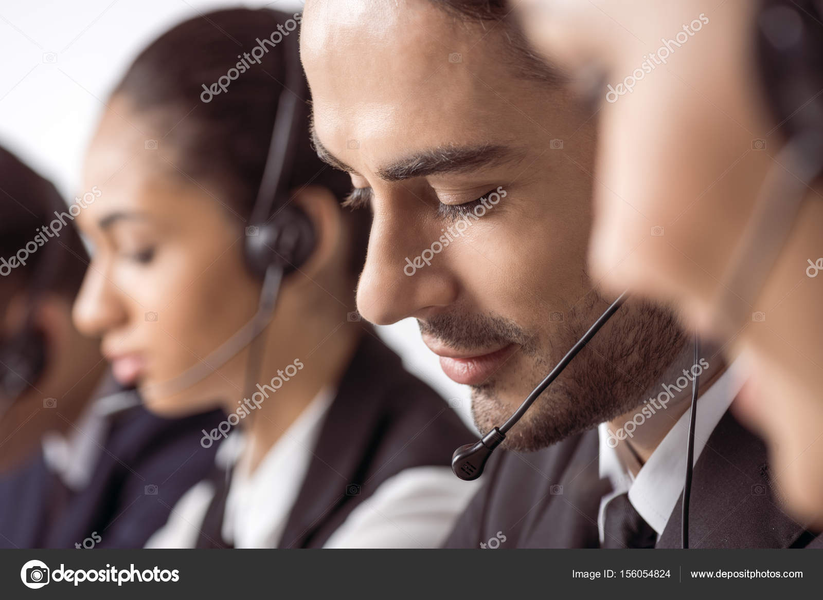 Call center operators in headsets — Stock Photo © DmitryPoch #156054824