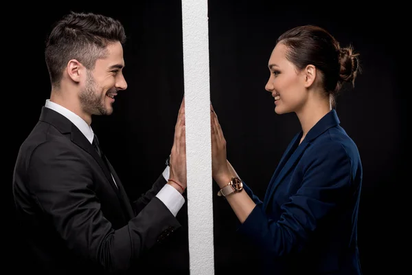 Couple separated by wall - Stock Image - Everypixel