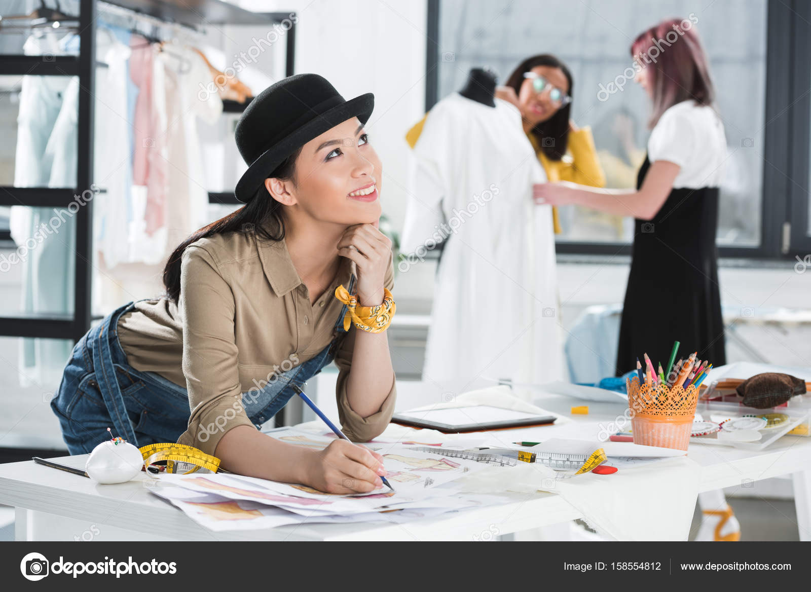 Asian fashion designer working — Stock Photo © DmitryPoch #158554812