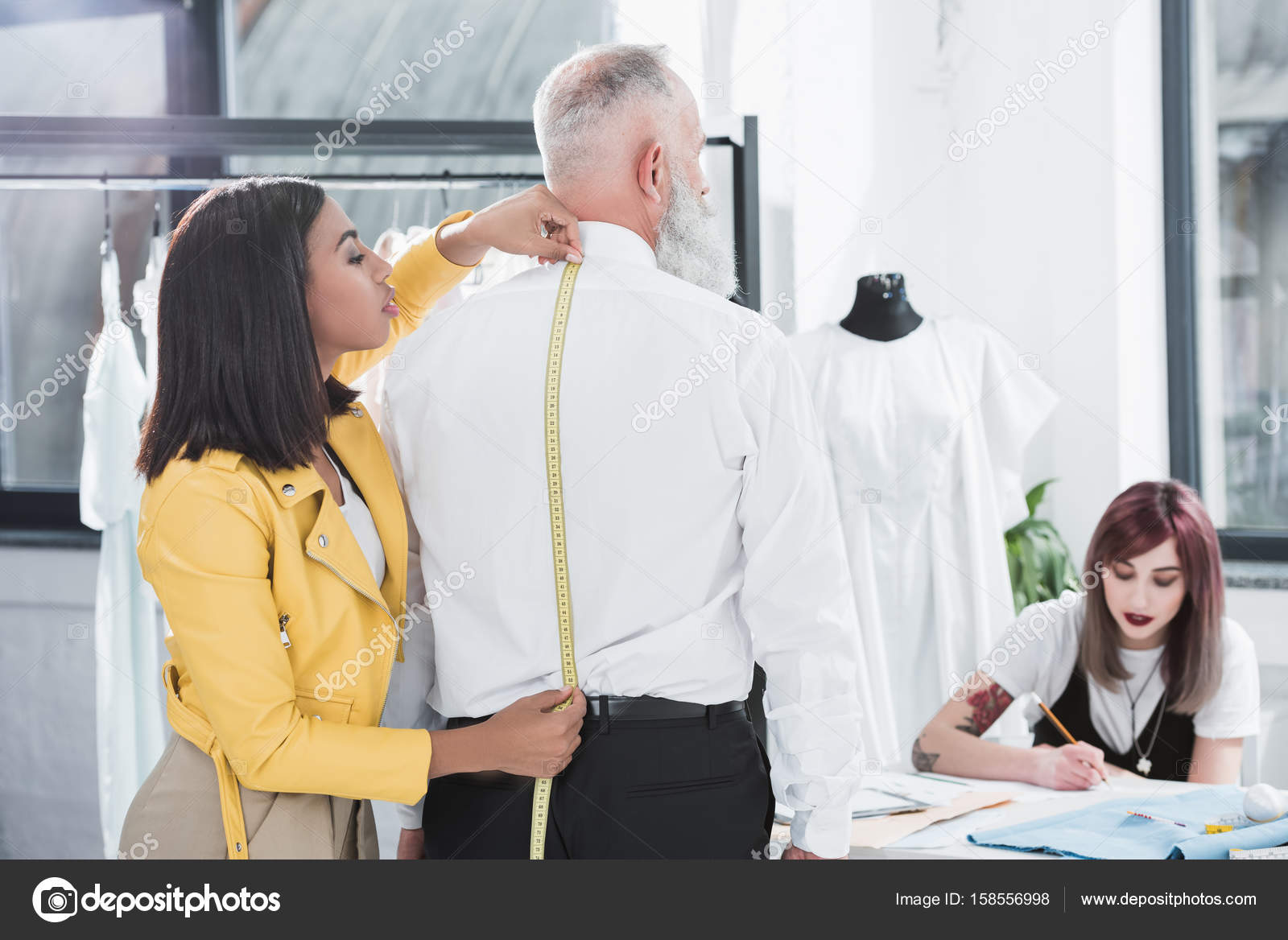 Tailor measuring grey haired man — Stock Photo © DmitryPoch #158556998
