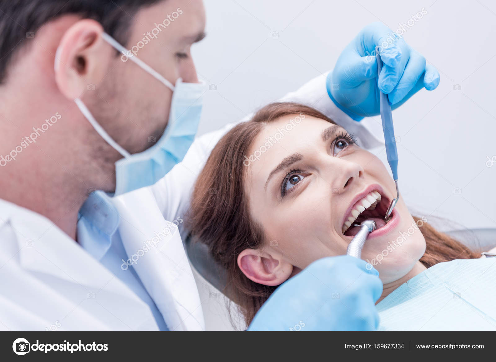 Dentist curing patients teeth — Stock Photo © DmitryPoch #159677334