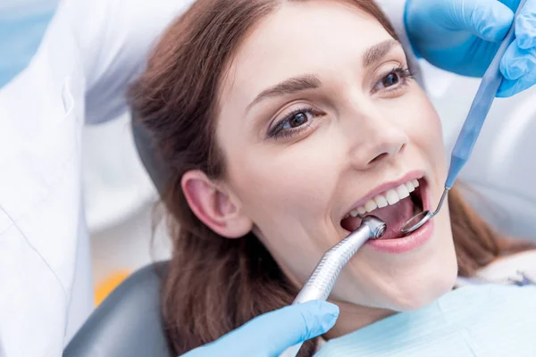 Dentist curing patients teeth — Stock Photo © DmitryPoch #159677334