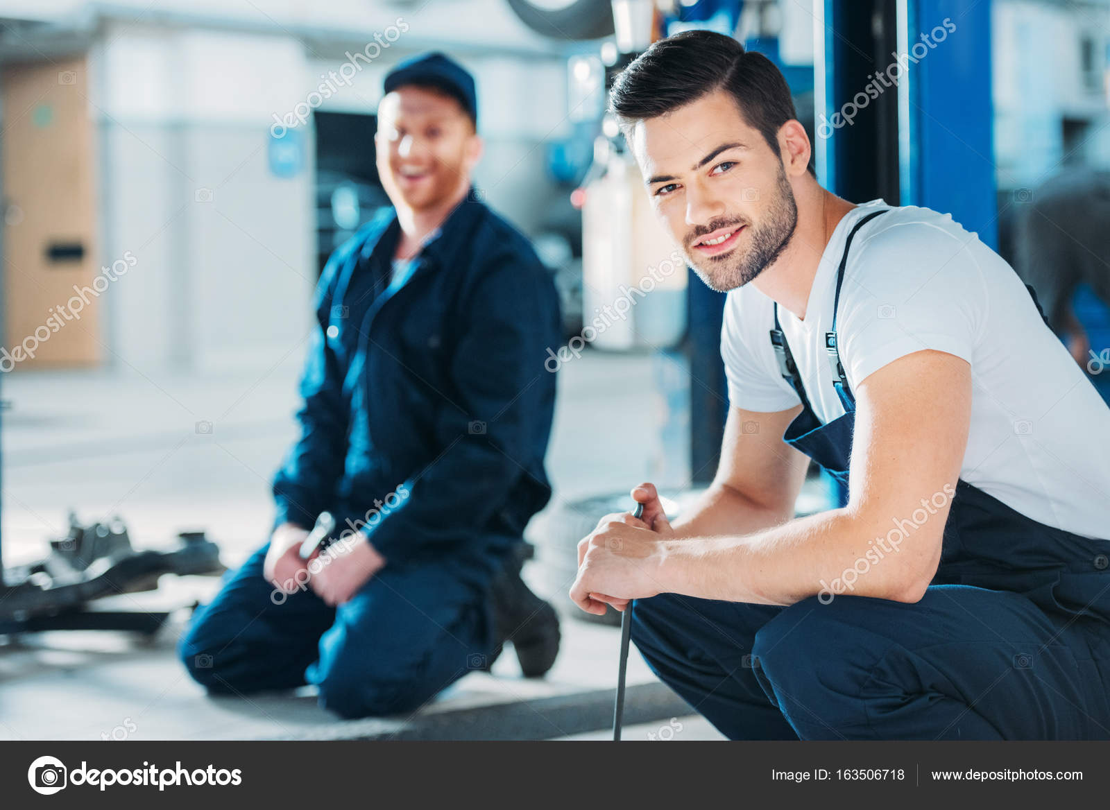 Automechanics sitting on floor — Stock Photo © DmitryPoch #163506718