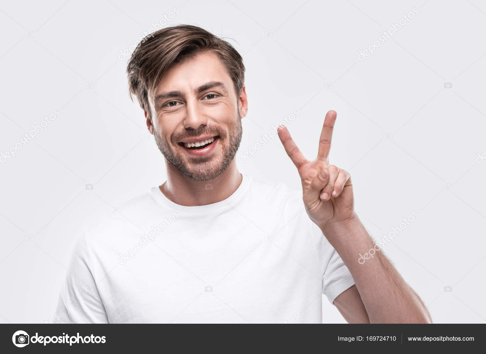 Man showing victory sign — Stock Photo © DmitryPoch #169724710