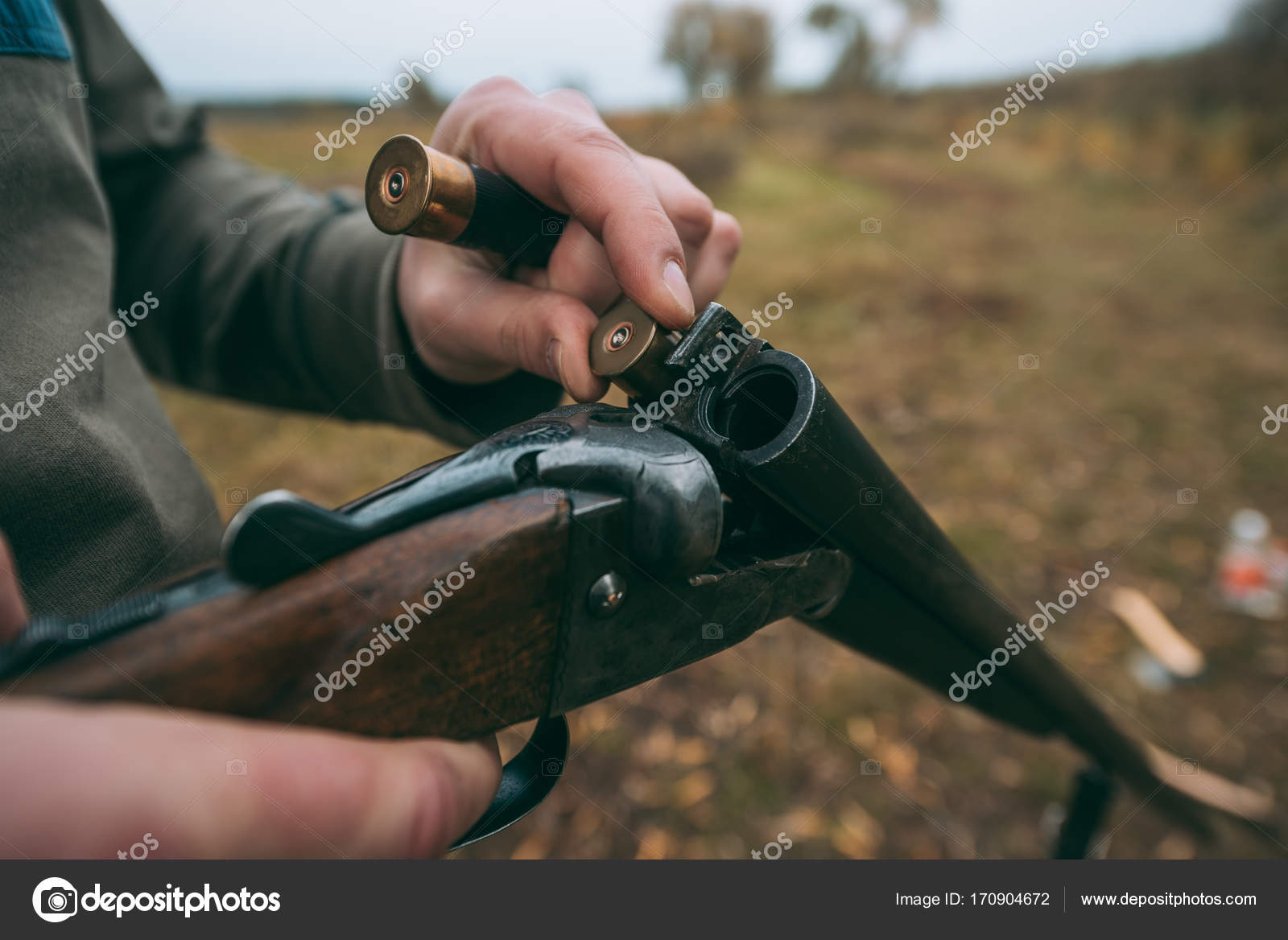 Hunter loading gun with bullets — Stock Photo © DmitryPoch #170904672