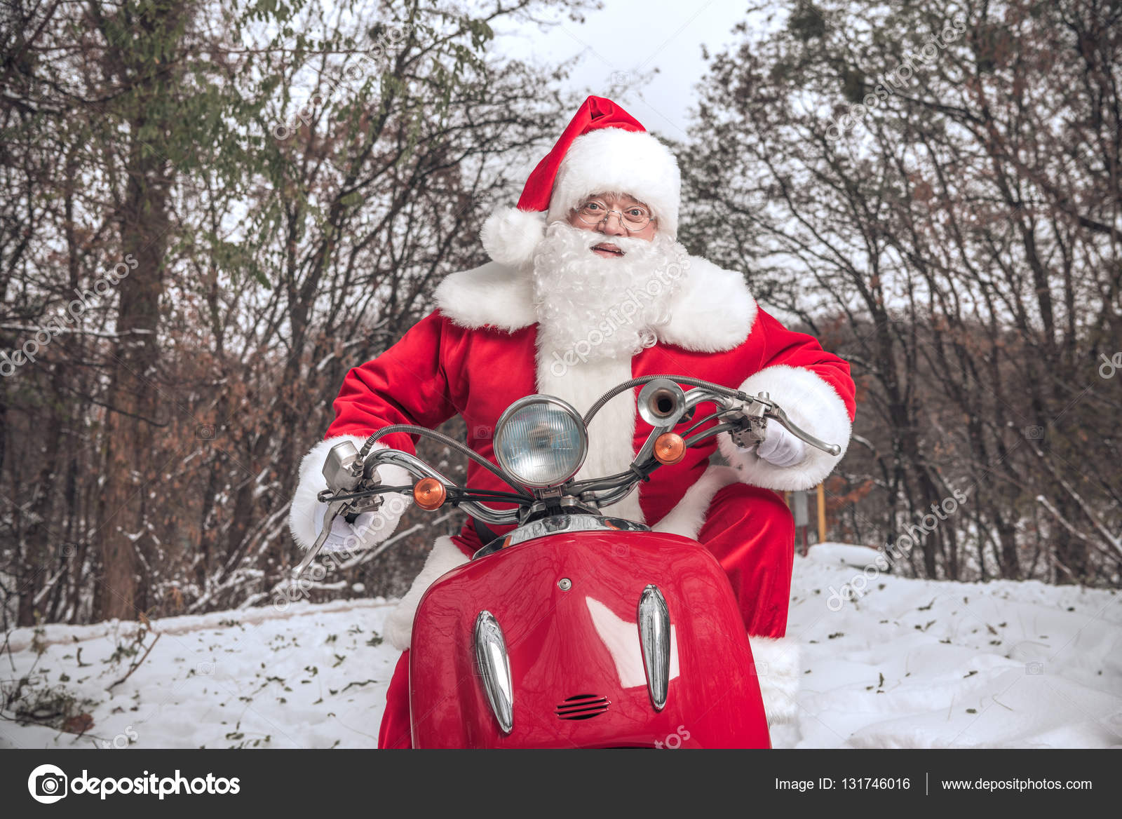Santa Claus riding on scooter — Stock Photo © AndrewLobov #131746016