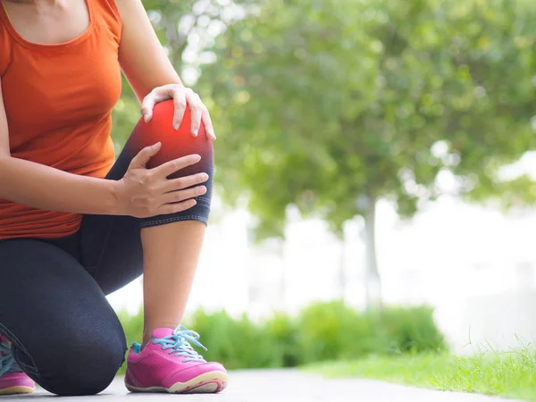 Runner sport knee injury. Woman in pain while running - Stock Image ...