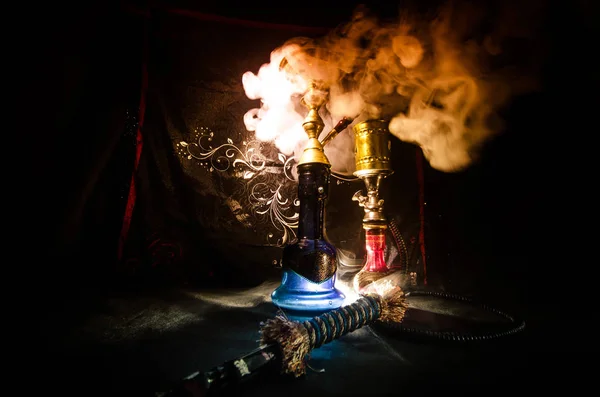 Hookah hot coals on shisha bowl on dark foggy background. Stylish ...
