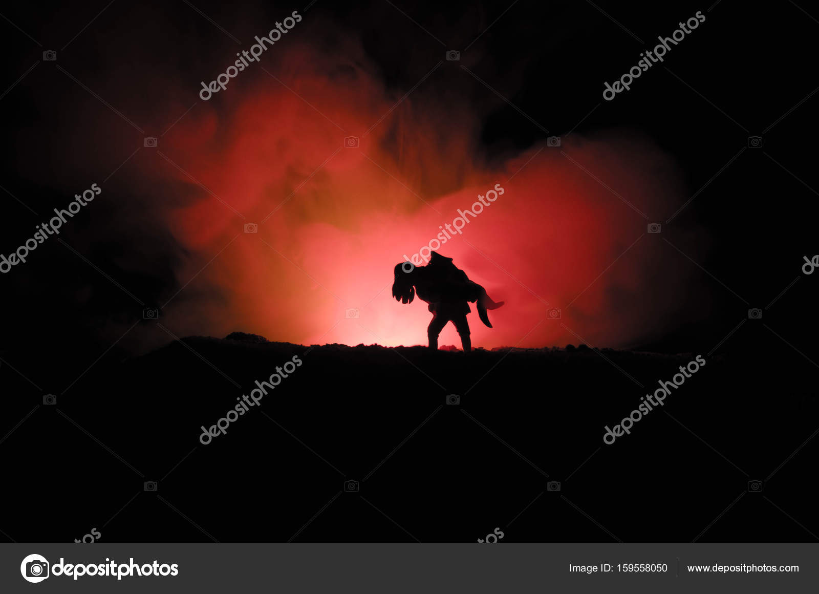 A silhouette of a man holding on to the woman. Rescue saviour concept ...