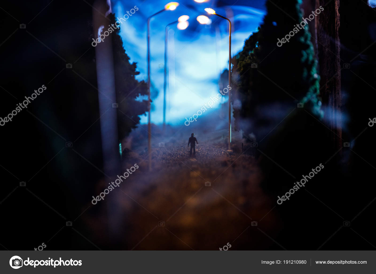 City at night in dense fog. Thick smog on a dark street. Silhouettes of ...