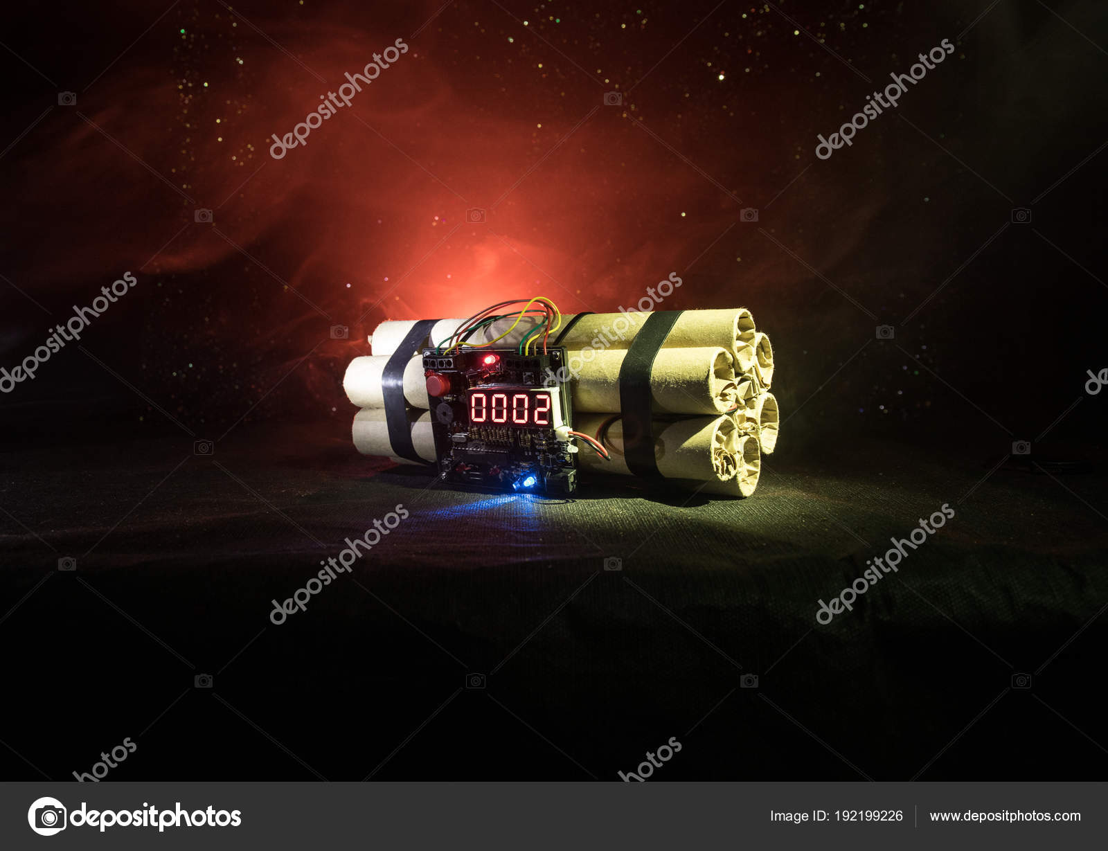 Image of a time bomb against dark background. Timer counting down to ...