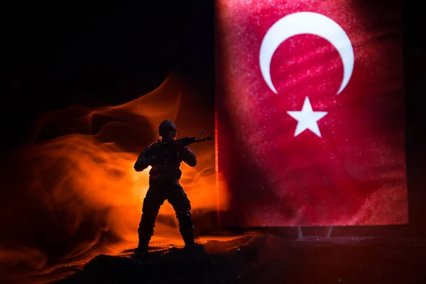 Turkish army concept. Silhouette of armed soldier against a Turkish ...