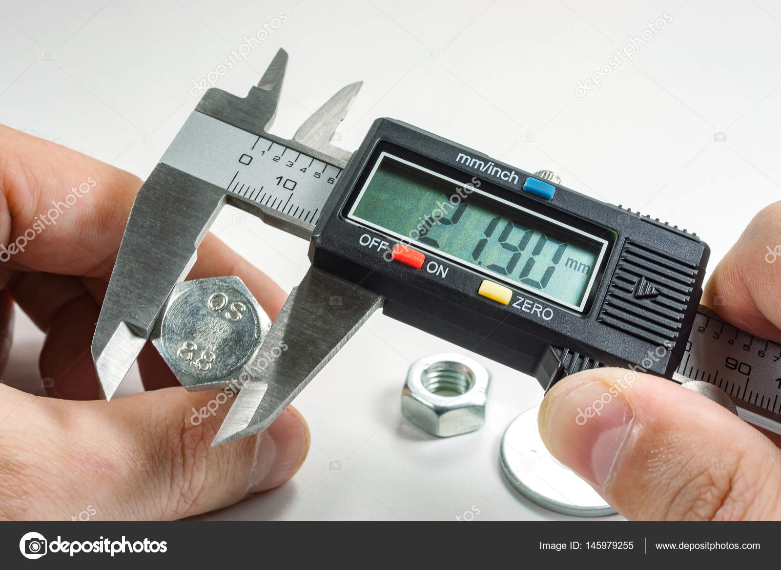 Measurements by a digital caliper in the master's hand — Stock Photo ...