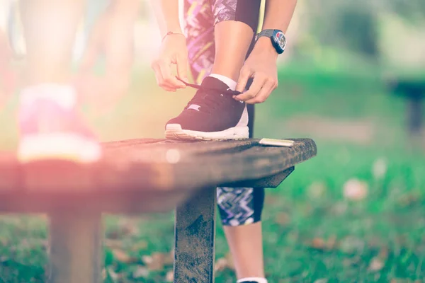 Woman getting ready to start running workout - Stock Image - Everypixel
